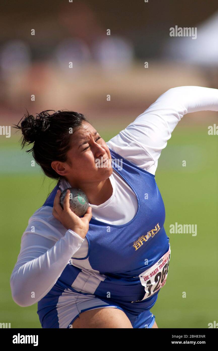 Austin Texas USA, June 6, 2009: Female shot putter prepares to throw in the shot put event with ...