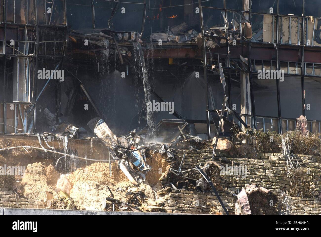 Austin Texas USA, February 18 2010: Smoke rises from rubble of office ...