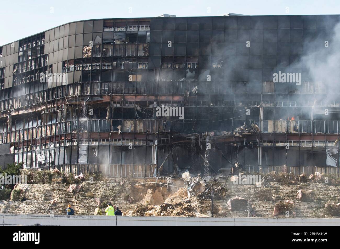 Austin Texas USA, February 18 2010: Smoke rises from rubble of office ...