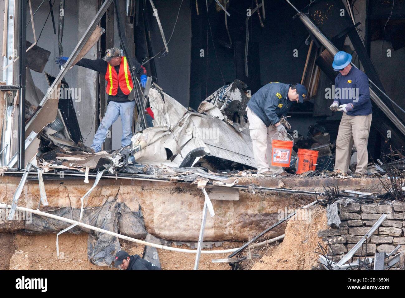 Austin, Texas USA, February 20, 2010. Federal investigators from the ...