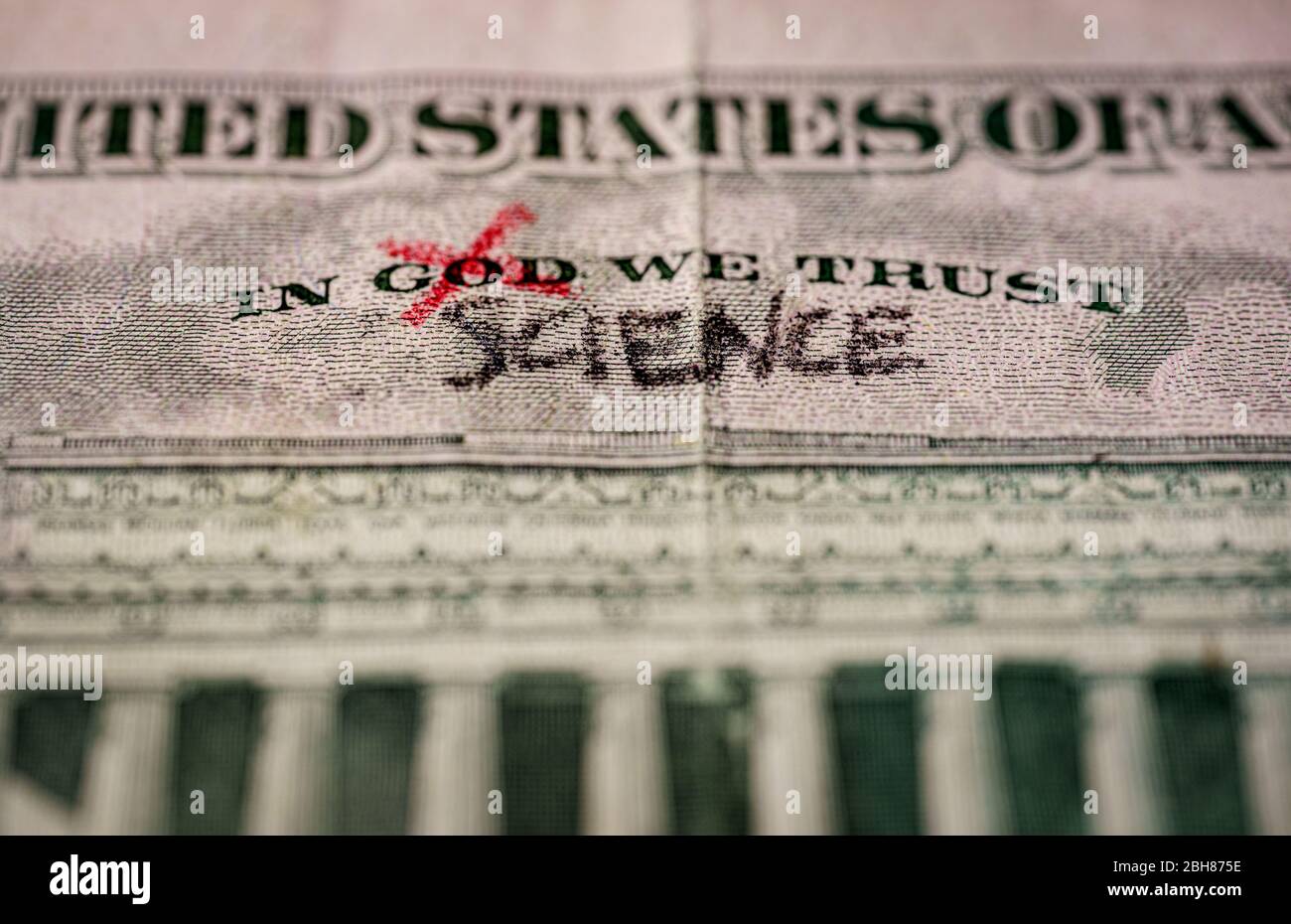 word God crossed out and replaced by science on a US dollar bill Stock ...