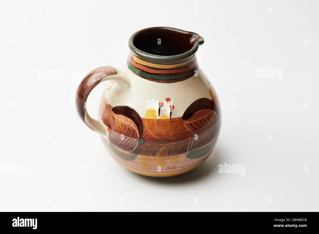 small patterned porcelain jug on white background Stock Photo - Alamy