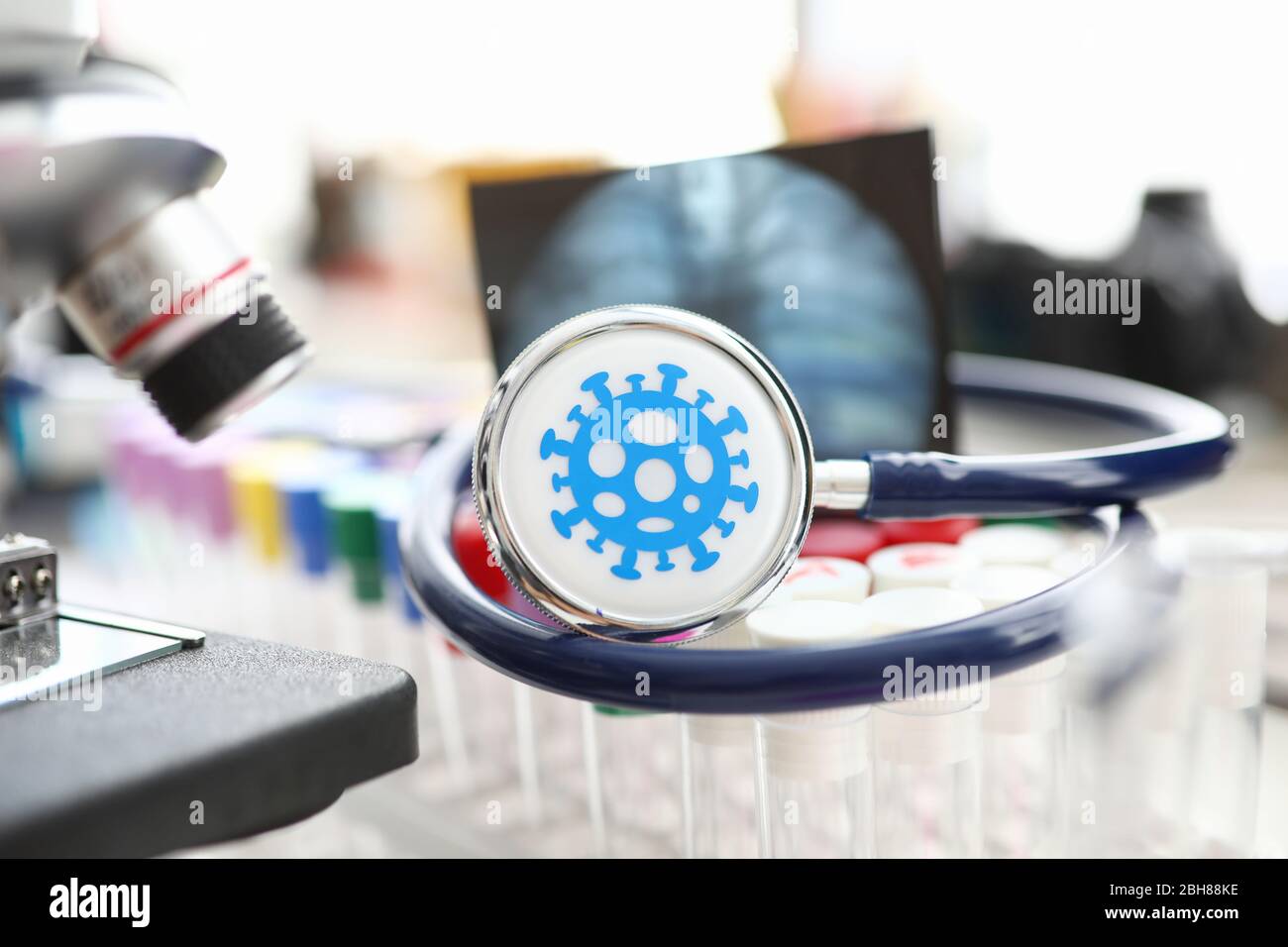 Medical stethoscope lying on set of vials at scientific lab Stock Photo ...