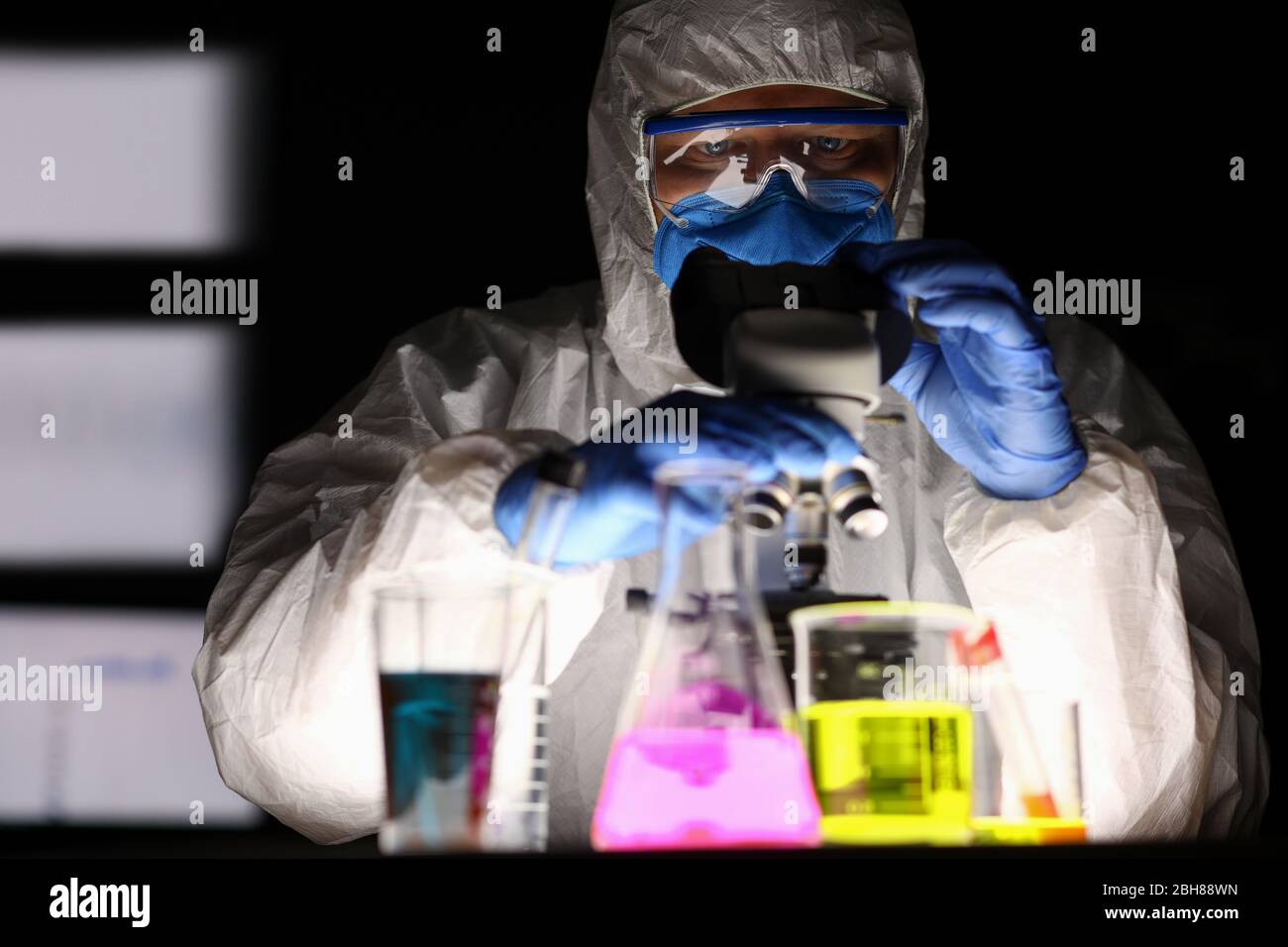 Man in protective costume and gloves Stock Photo - Alamy