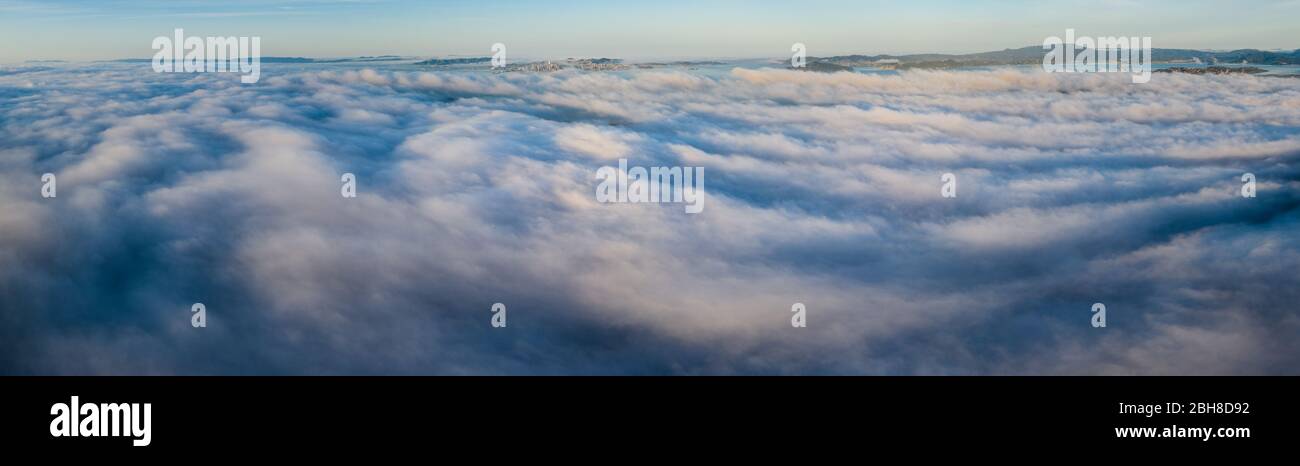 Sunrise illuminates the marine layer covering the entirety of San ...