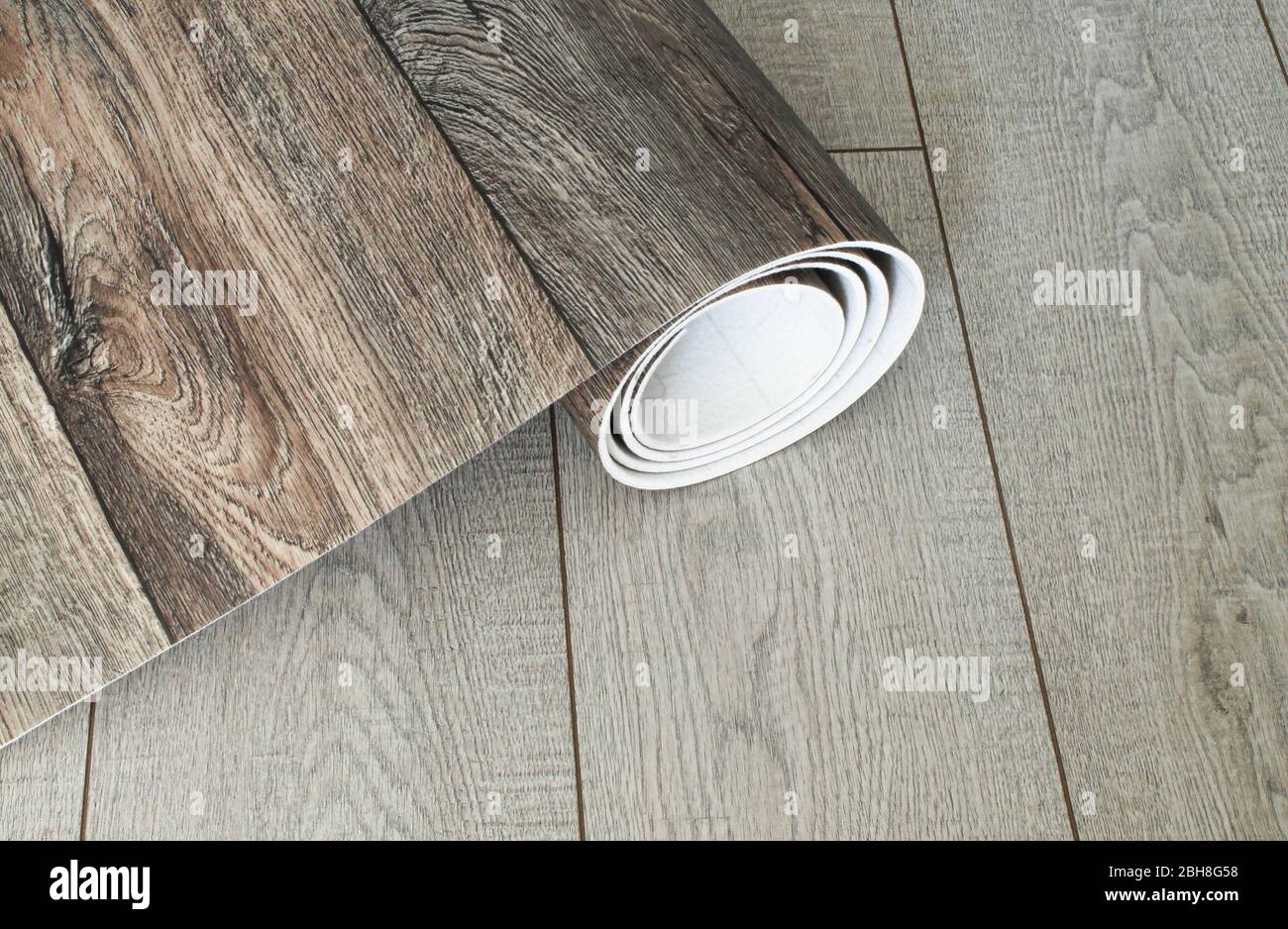 Roll of linoleum with a wood texture. Types of floor coverings Stock ...
