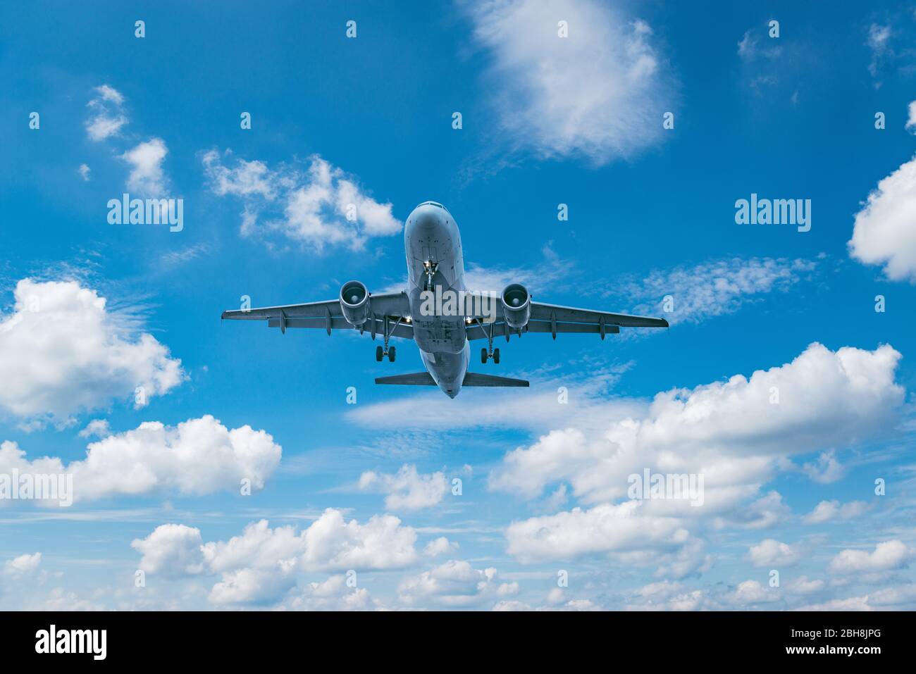 Passenger plane is ready for landing in the day sky Stock Photo - Alamy