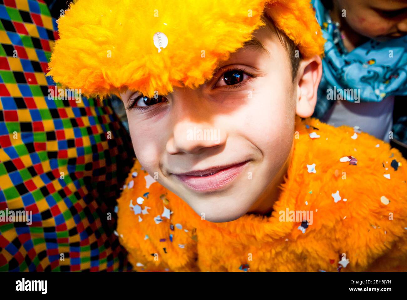 Cheerful children male smiling and having fun doing carnival ...