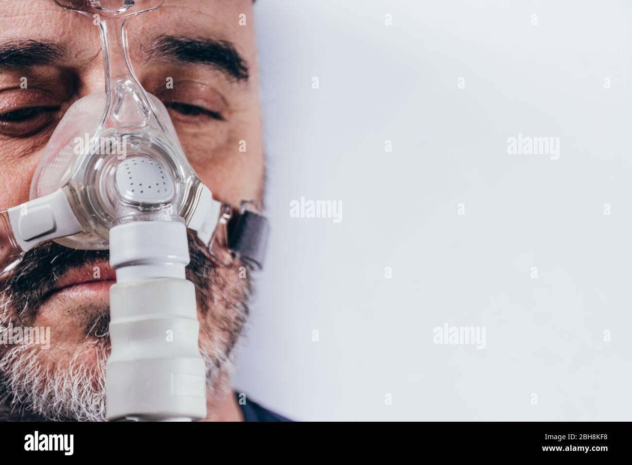 Senior man with respiratory mask for sleep disorders. Apnea. Medical ...