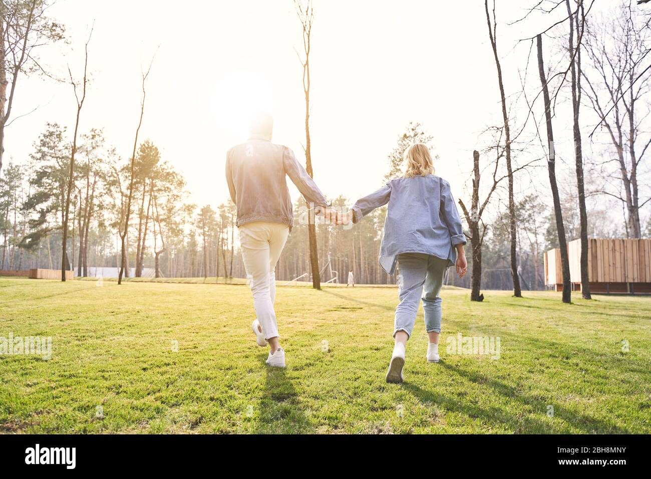 Two People Walking Hand In Hand