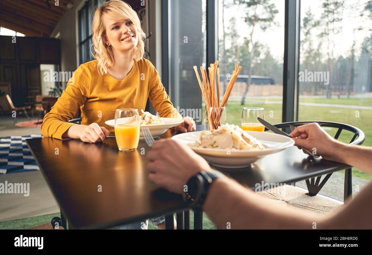 Cheerful lady and her boyfriend having lunch together Stock Photo - Alamy
