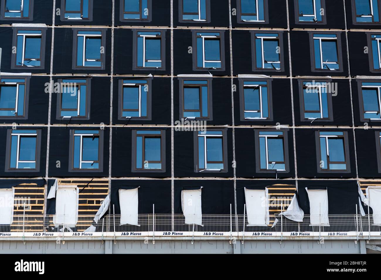 The exposed cladding on the exterior of a new building on a ...