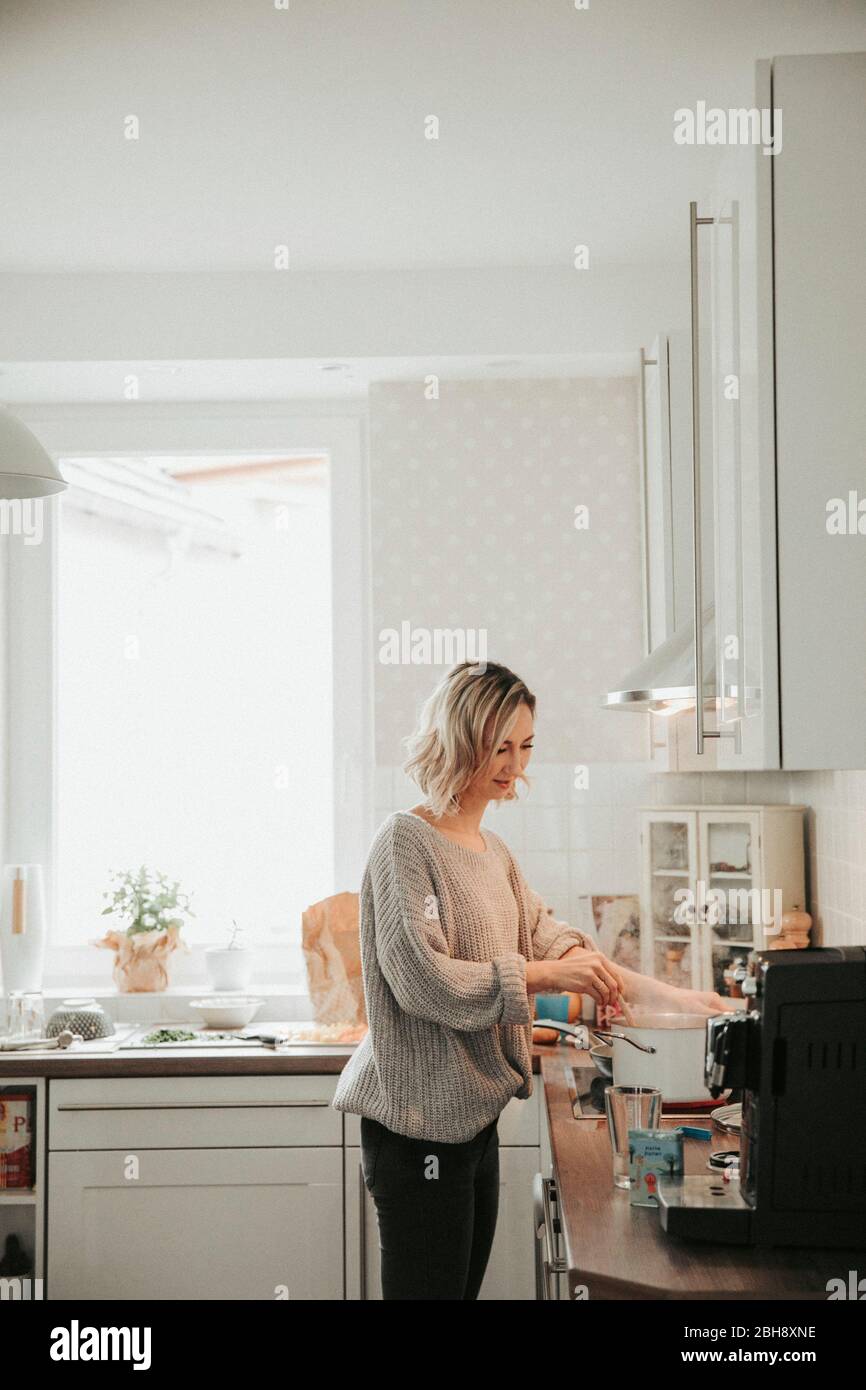 Woman cooking pot hi-res stock photography and images - Alamy