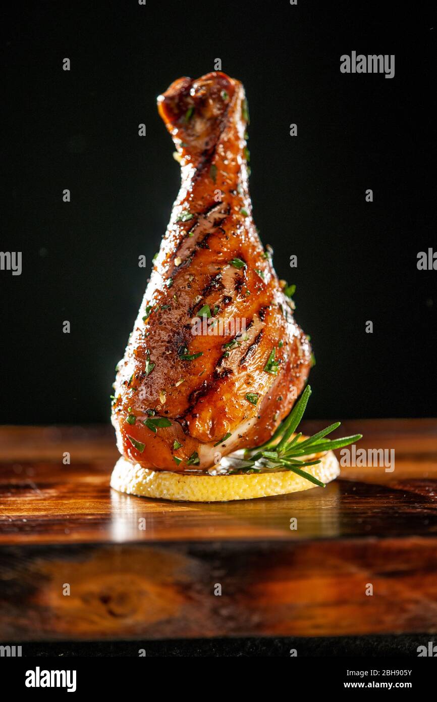 Grilled Chicken Leg on a decorative presentation Stock Photo - Alamy