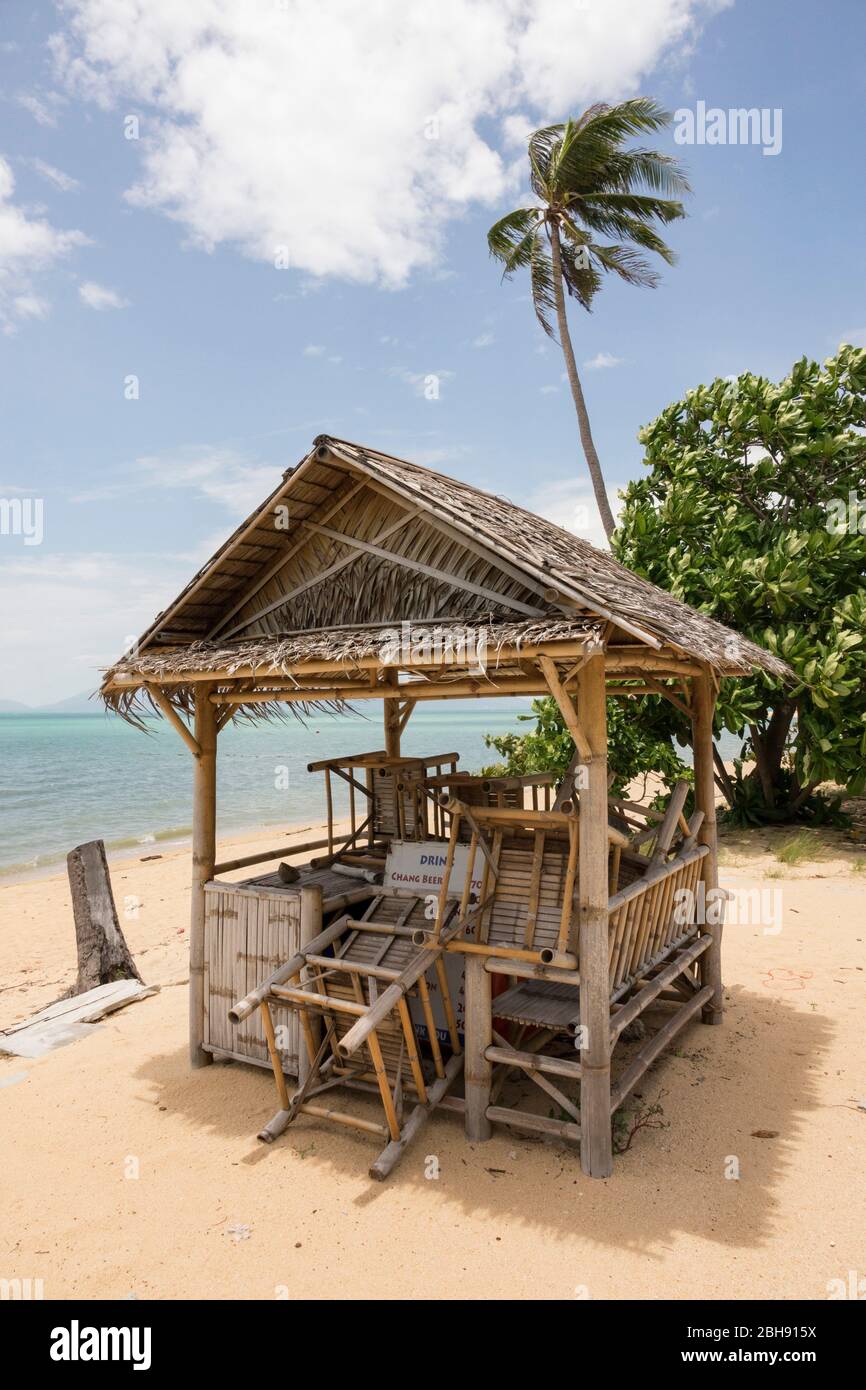 small, simple beach restaurant at the sea with palm tree Stock Photo ...