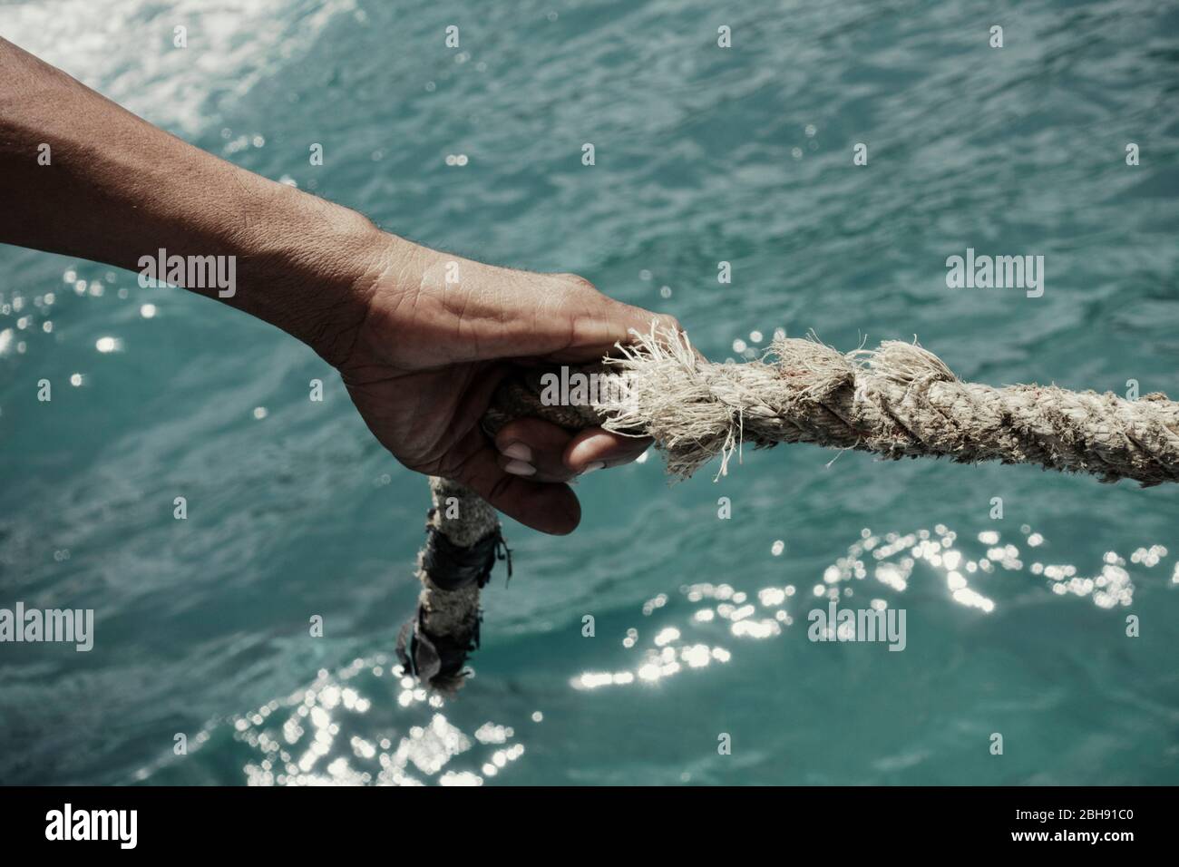 Hand holding rope hi-res stock photography and images - Alamy