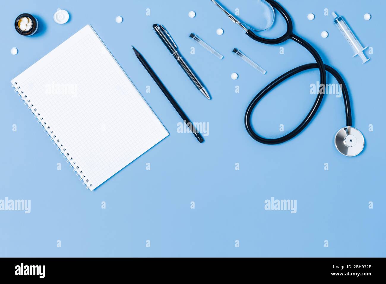 Medical blue background with different accessories: stethoscope ...
