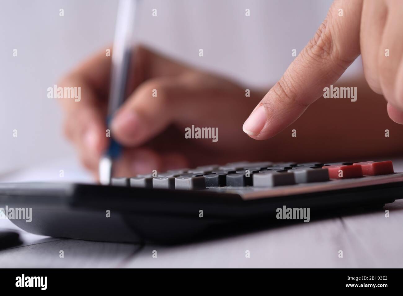 women hand using calculator on offie desk Stock Photo - Alamy