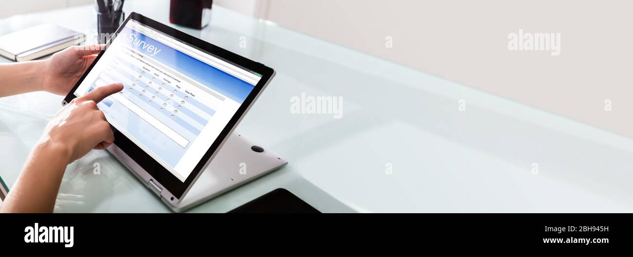 Filling Digital Survey Form On Laptop Screen Stock Photo - Alamy