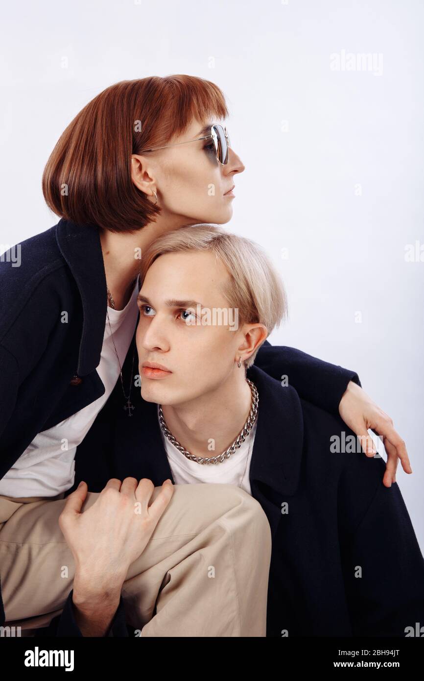 Human profiles. Guy and girl hug. The red-haired girl put her head on ...