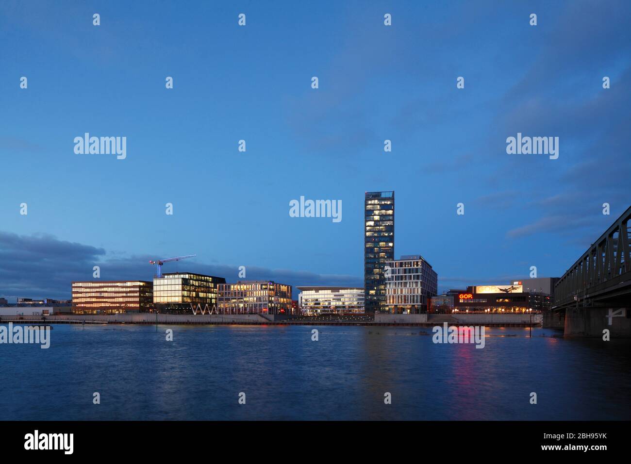 Office building with Weser Tower in Bremen's Überseestadt at dusk ...