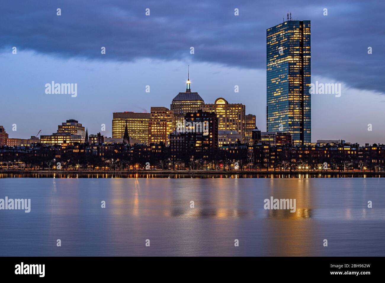 Blue hour cityscape buildings reflecting in water Stock Photo - Alamy