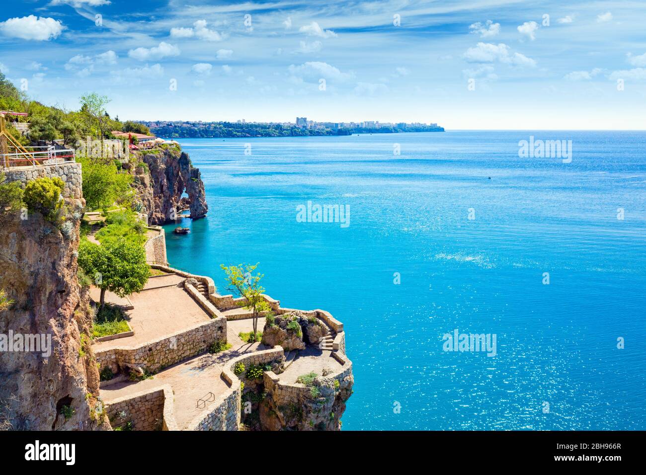 Viewing and resting terrace on slope of cliff near beautiful blue Gulf ...