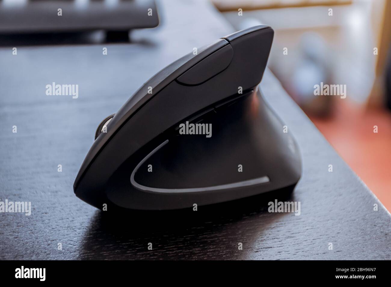 Ergonomic Mouse on a black desk during isolation Stock Photo - Alamy