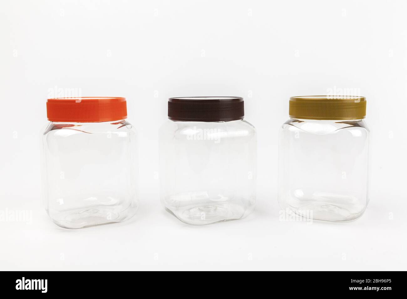 empty transparent plastic jar on white background Stock Photo - Alamy