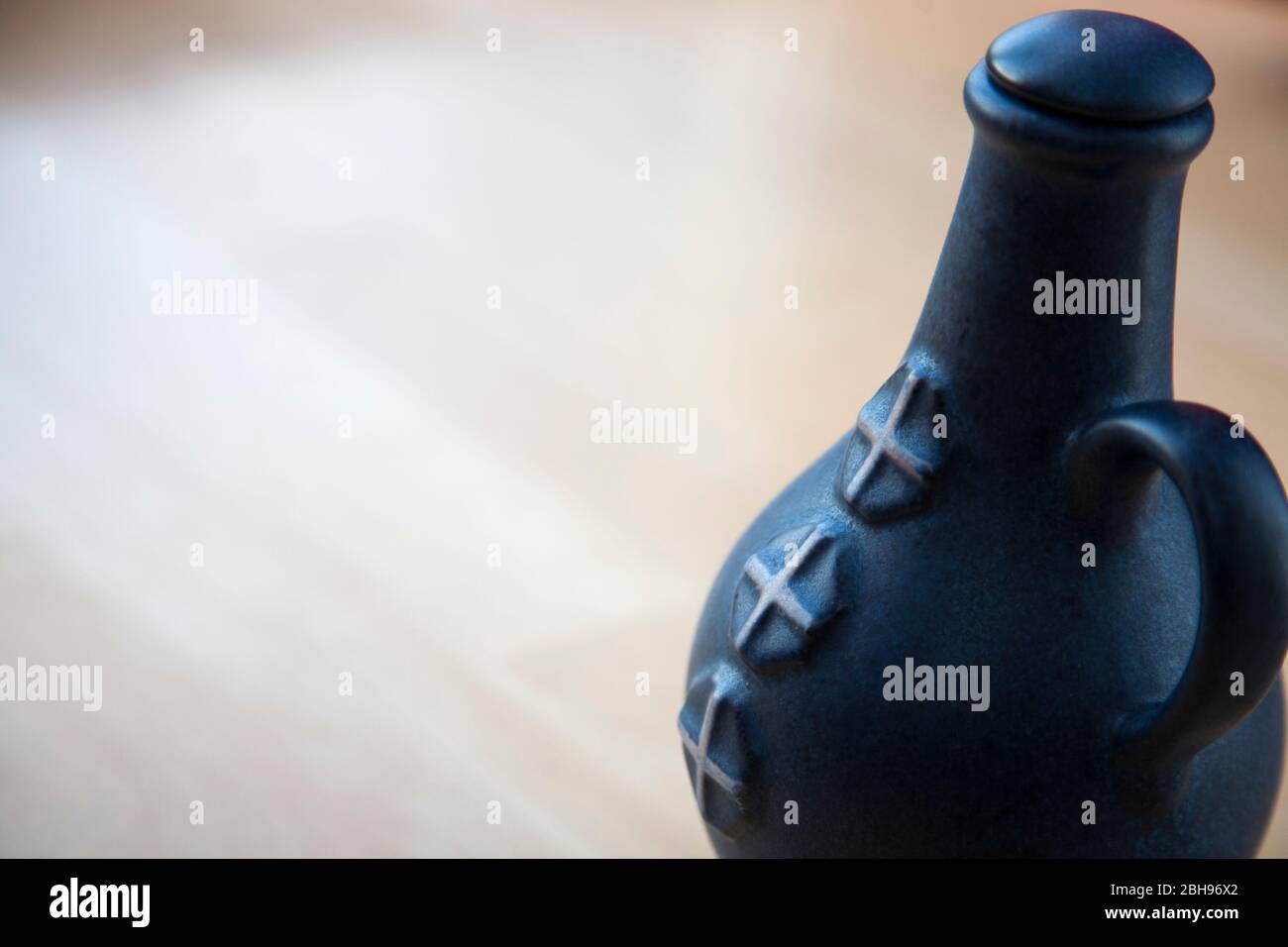 blue holy water jug with three crosses Stock Photo - Alamy