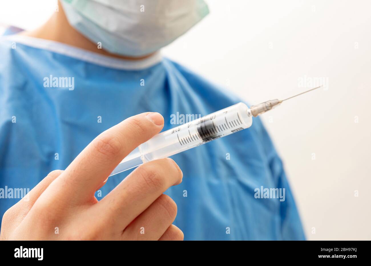 Syringe, medical injection vaccine in doctor hand close up view ...