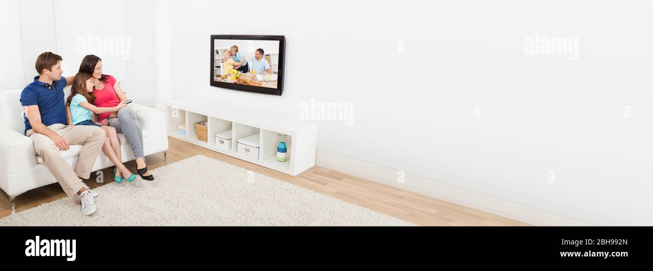Family With Kids Watching TV In Lounge Room. Family Lifestyle Stock ...