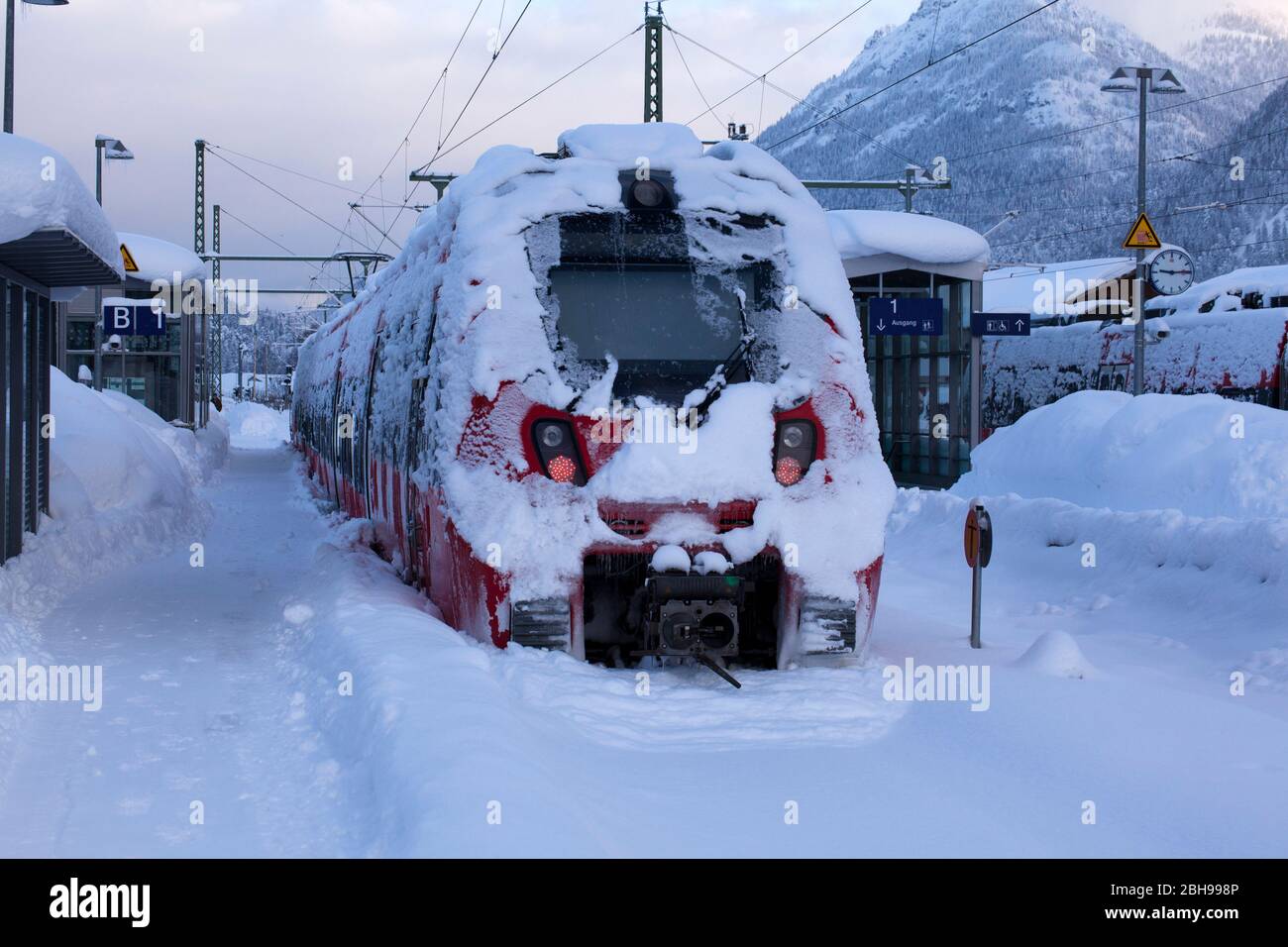 Snow-covered regional train in the station Stock Photo - Alamy