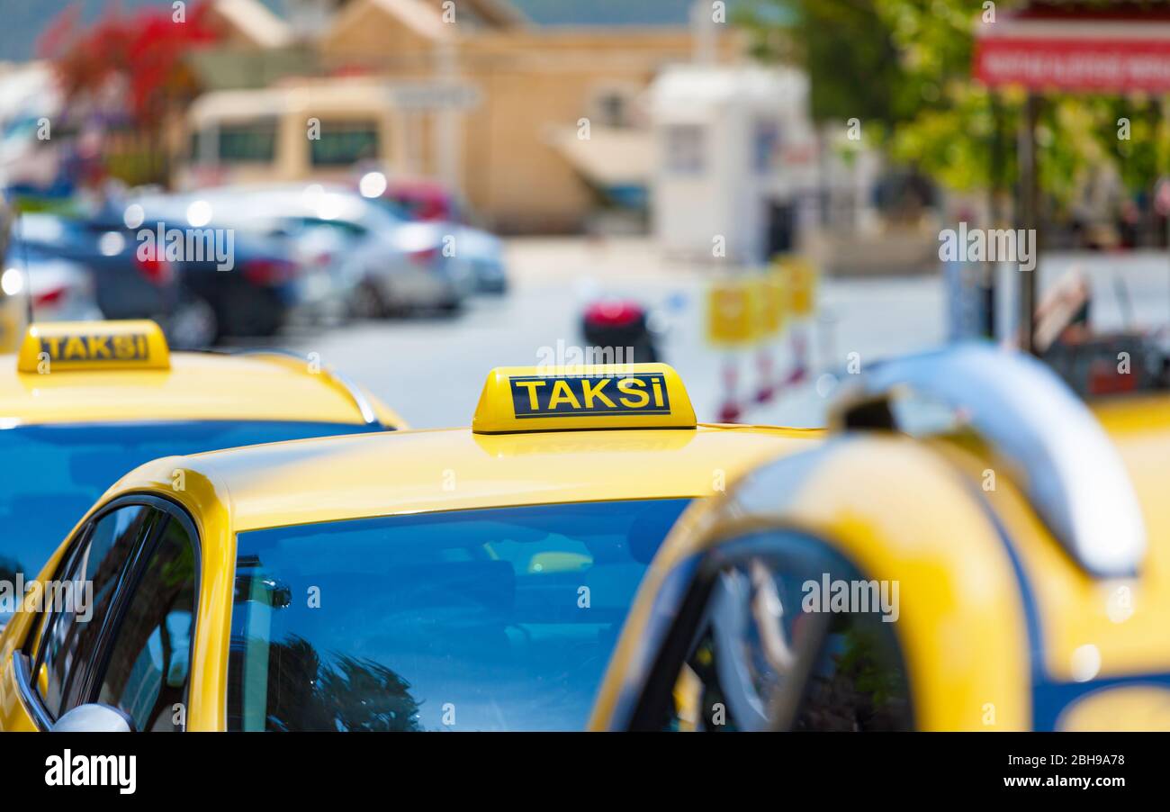 Yellow turkish taxi car on street of southern resort city in Turkey ...
