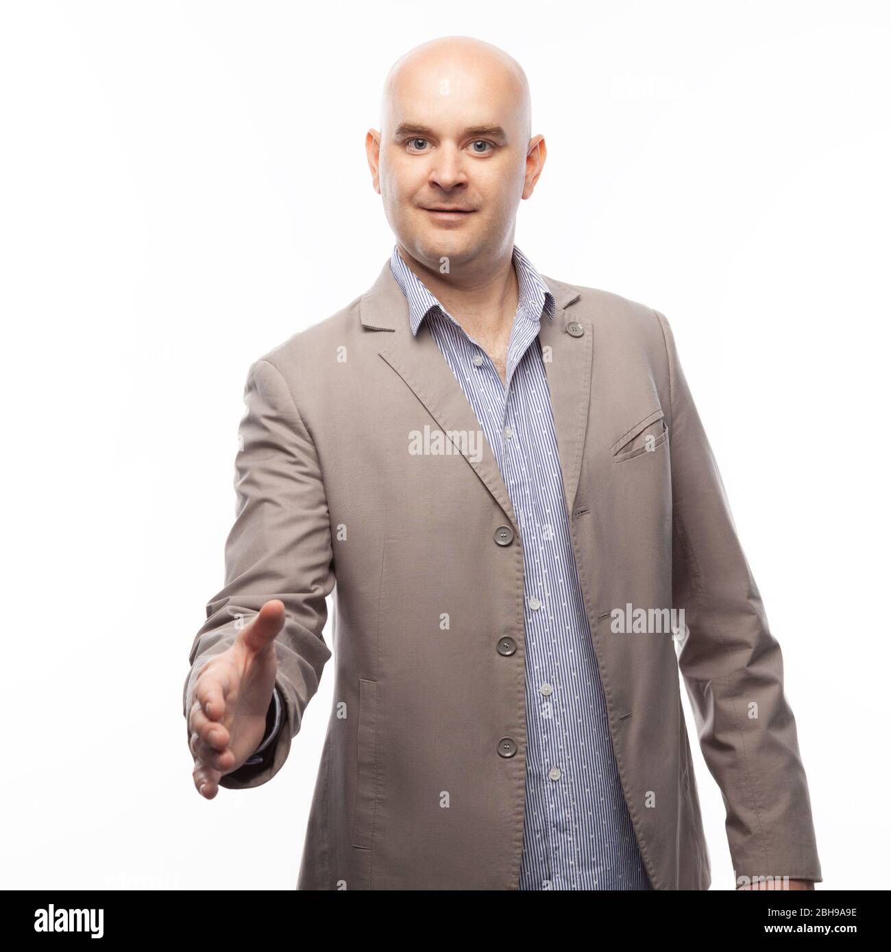 handsome bald man shaking hands. Isolated on white background Stock ...