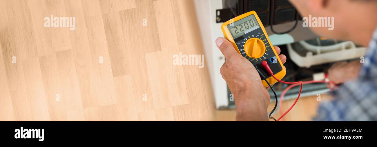 Testing Electric Appliance Using Multimeter To Repair Fridge At Home ...