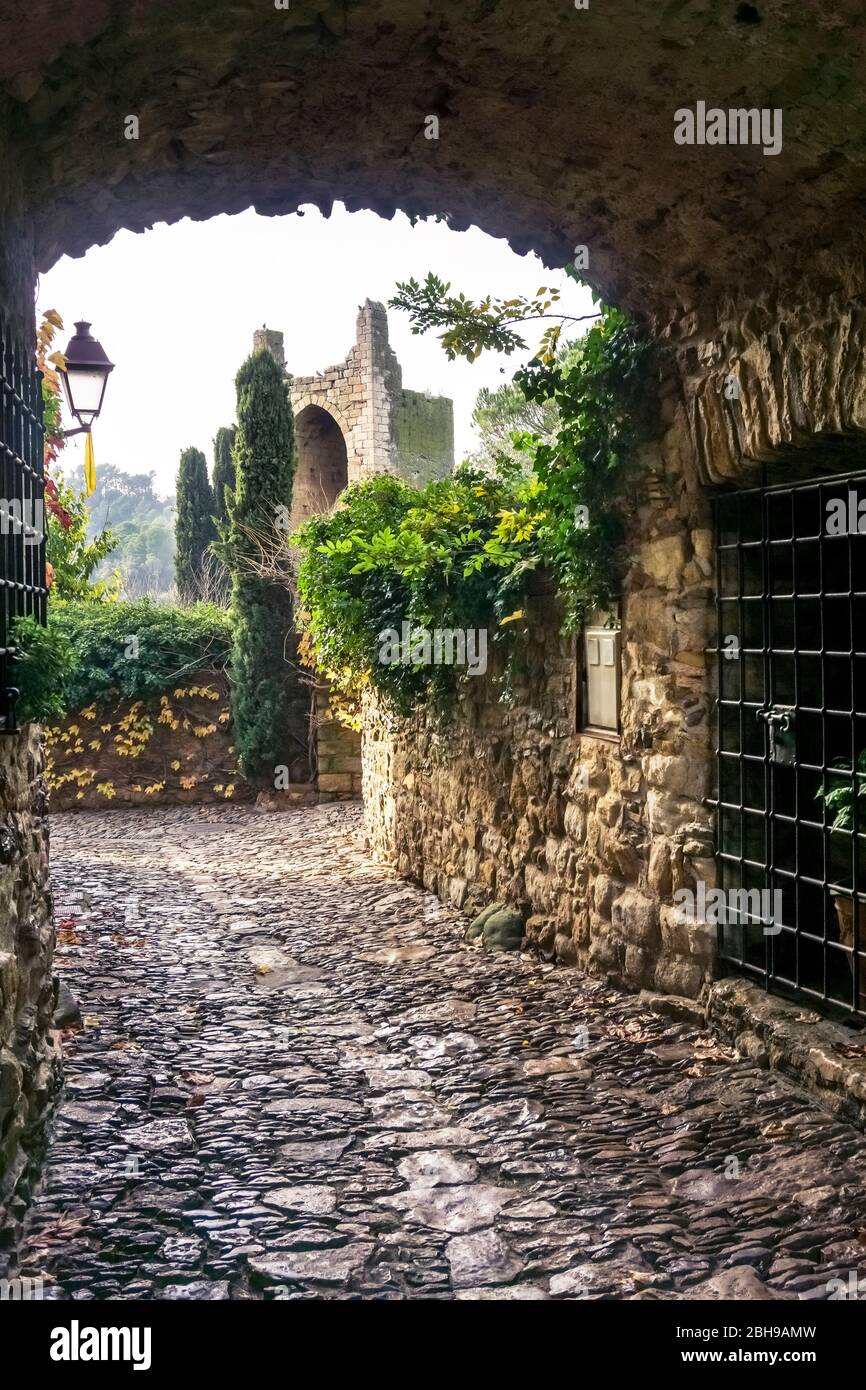 Stone vault overlooking Torre de les Hores in front of Peratallada in ...