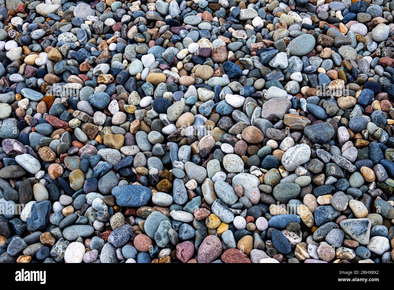 Pebbles on beach, background Stock Photo - Alamy