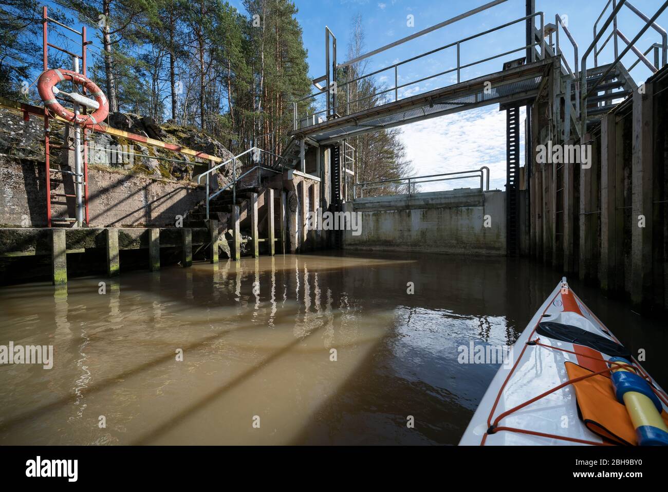 Kayaking through a canal sluice gate in Siuntio, Finland Stock Photo ...