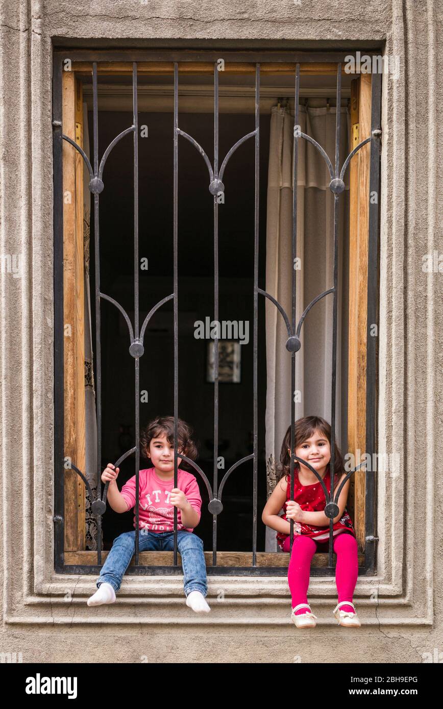 Georgia, Tbilisi, Old Town, two small girls in window, no releases ...