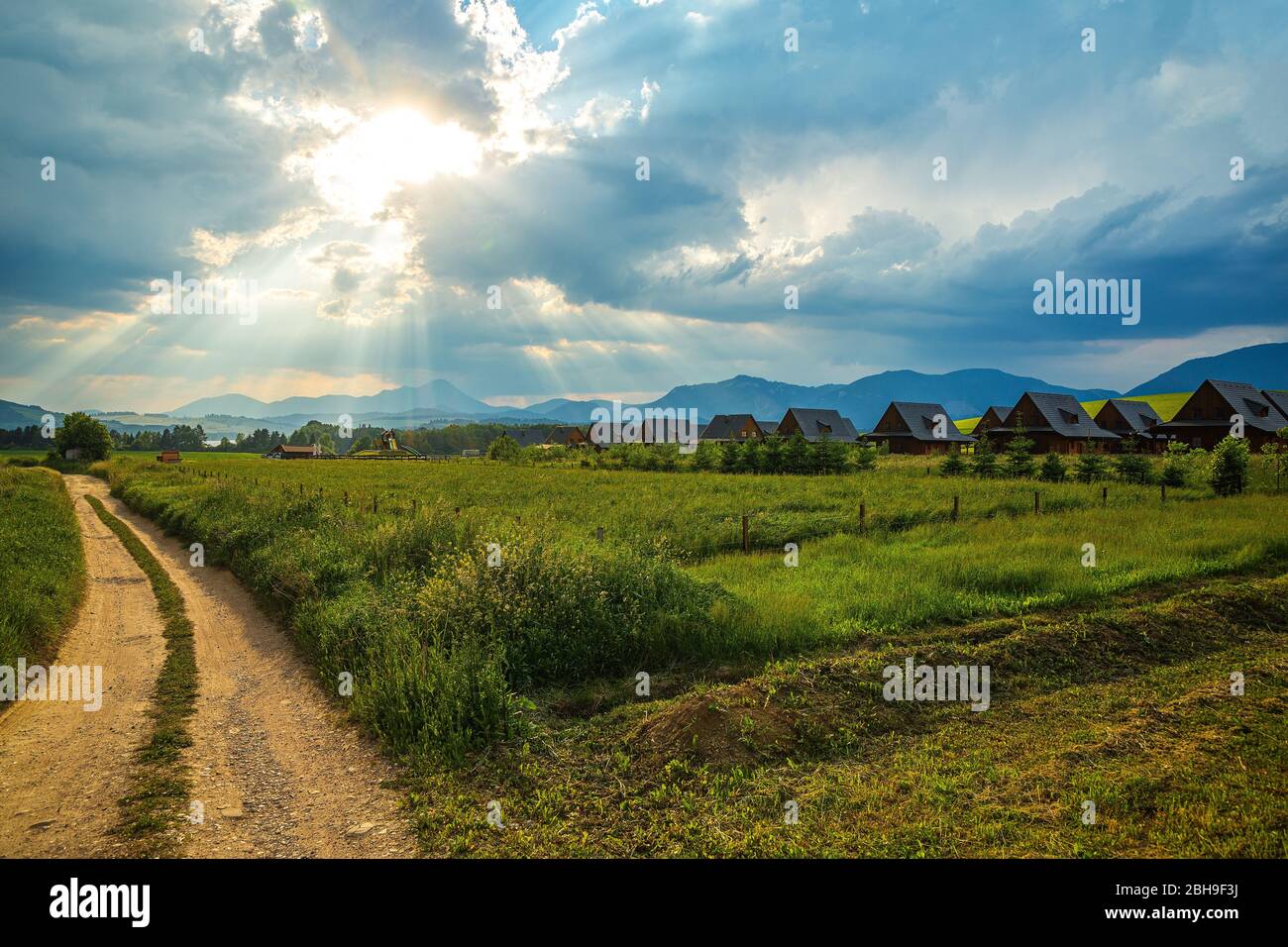 Cottages in the field Under the beautiful sky and the ray of the sun ...