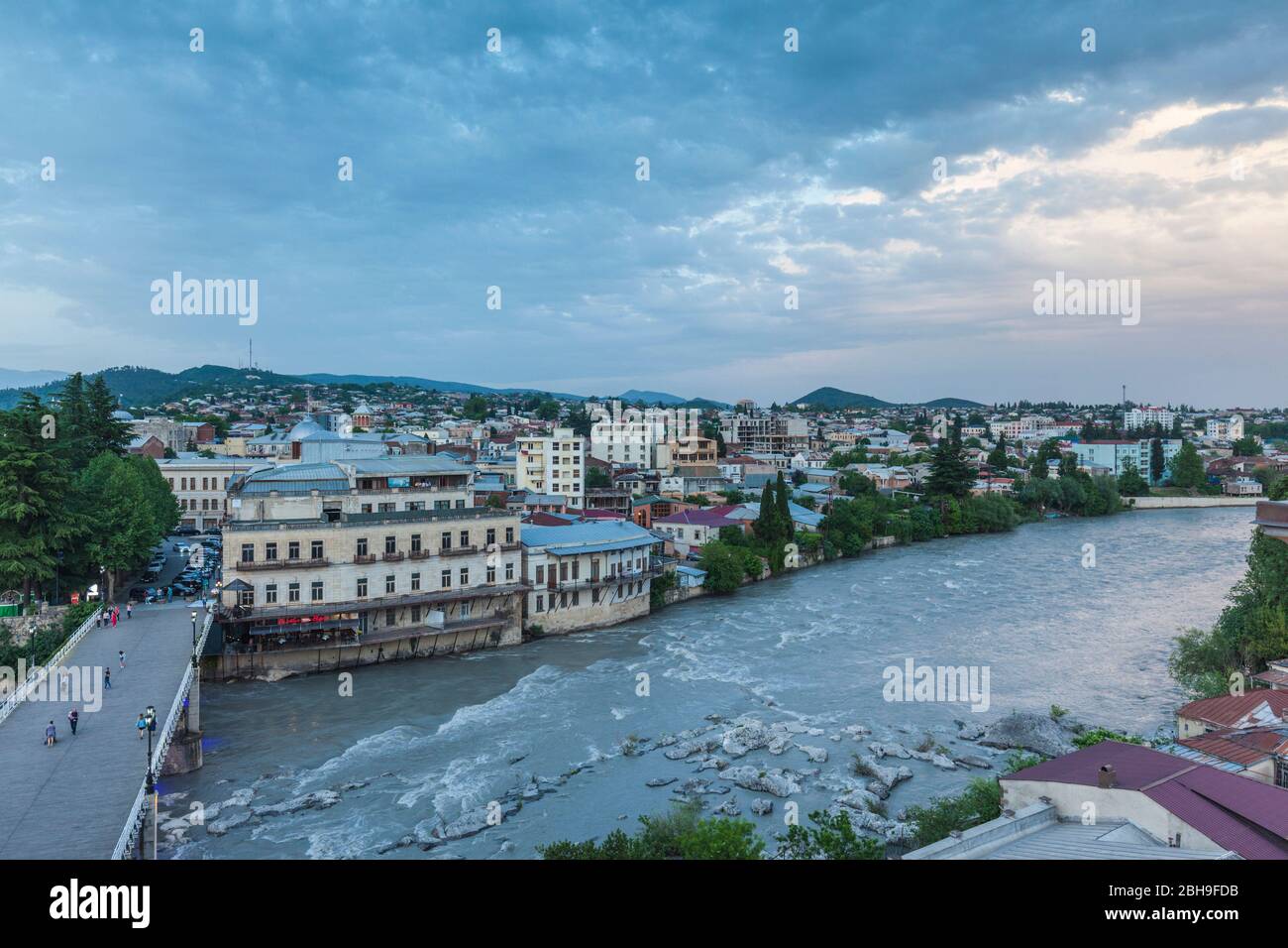 Georgia, Kutaisi, elevated city skyline along the Rioni River, dusk ...
