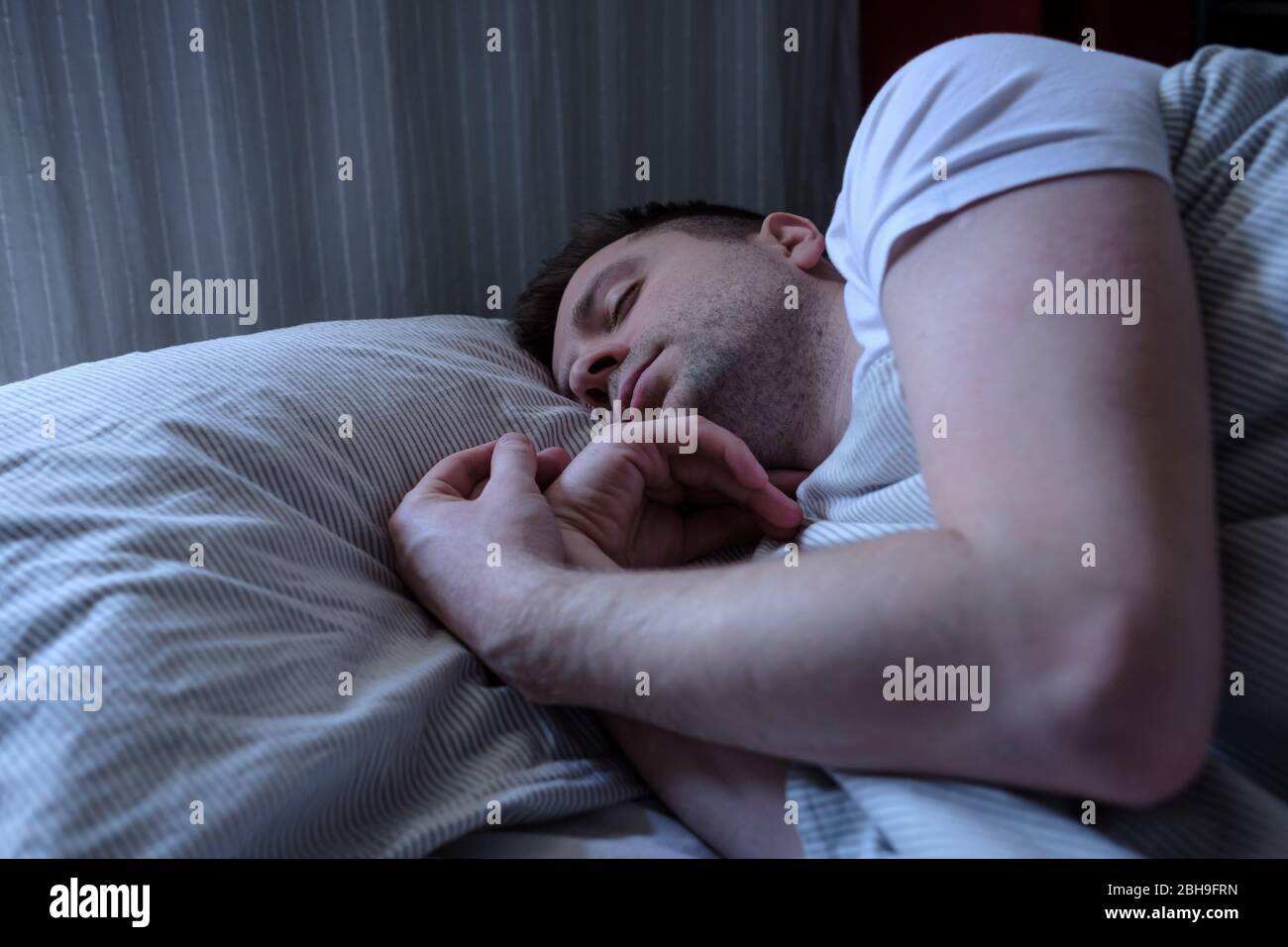 Man and sleeping alone and darkness hi-res stock photography and images ...