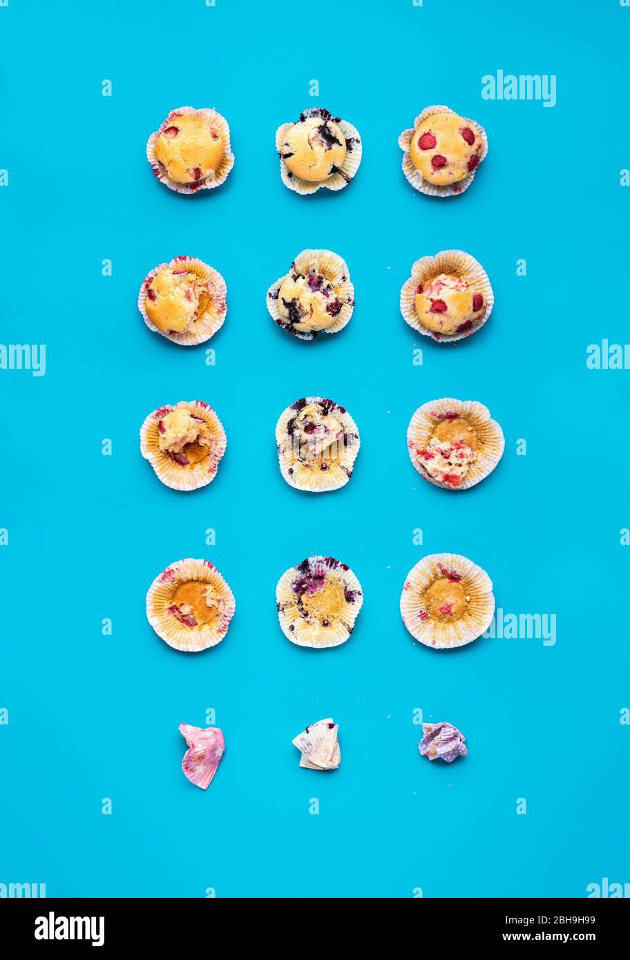 Muffins eating steps from whole to leftovers, above view. Homemade ...