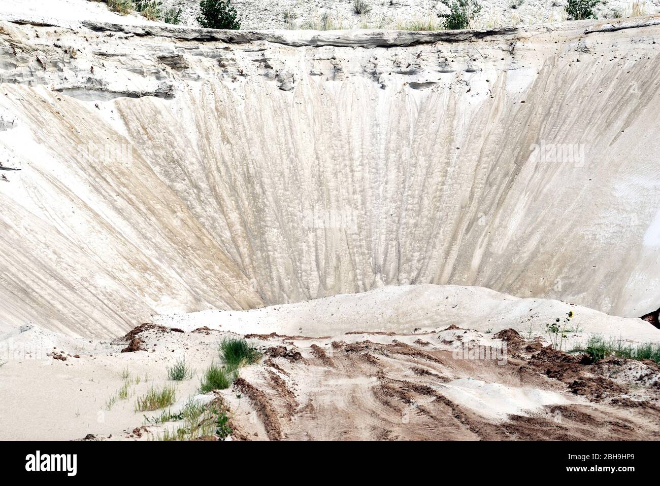 Slope of sandy mountain from white sand Stock Photo - Alamy