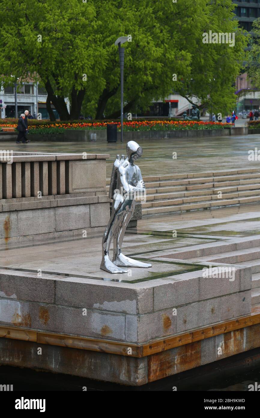 Ola Enstad's Dykkaren statue of silver scuba diver, Oslo Harbour Stock ...