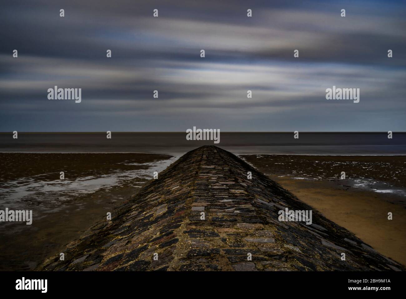Long time exposure of the North Sea at Cuxhaven with fast flying clouds ...