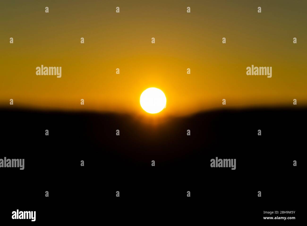 Sunrise over the forest Stock Photo - Alamy