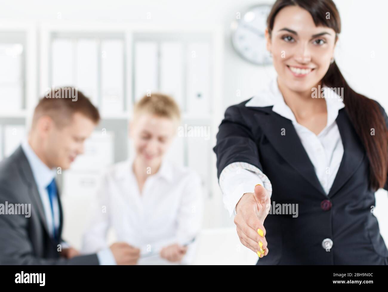 Formal greeting and welcoming gesture Stock Photo - Alamy