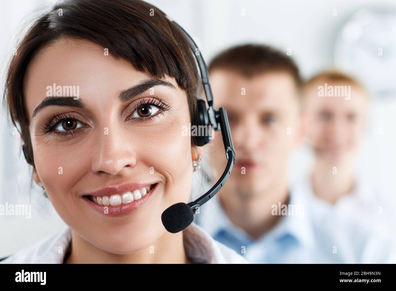 Three call center service operators at work Stock Photo - Alamy